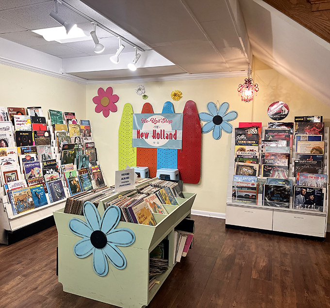Vinyl heaven! The record section bursts with colorful album art and musical treasures, complete with flower power decor that sets the mood.