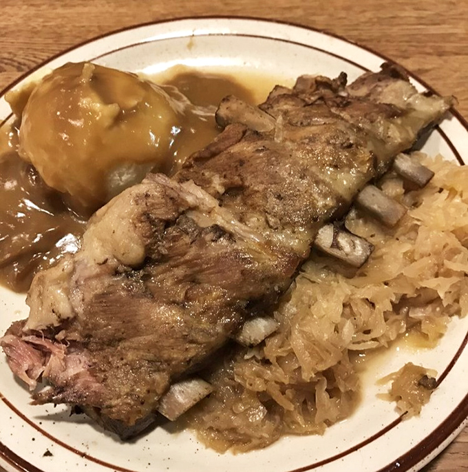 Meat so tender it surrenders to your fork without resistance. That sauerkraut cuts through the richness like a tart German referee.