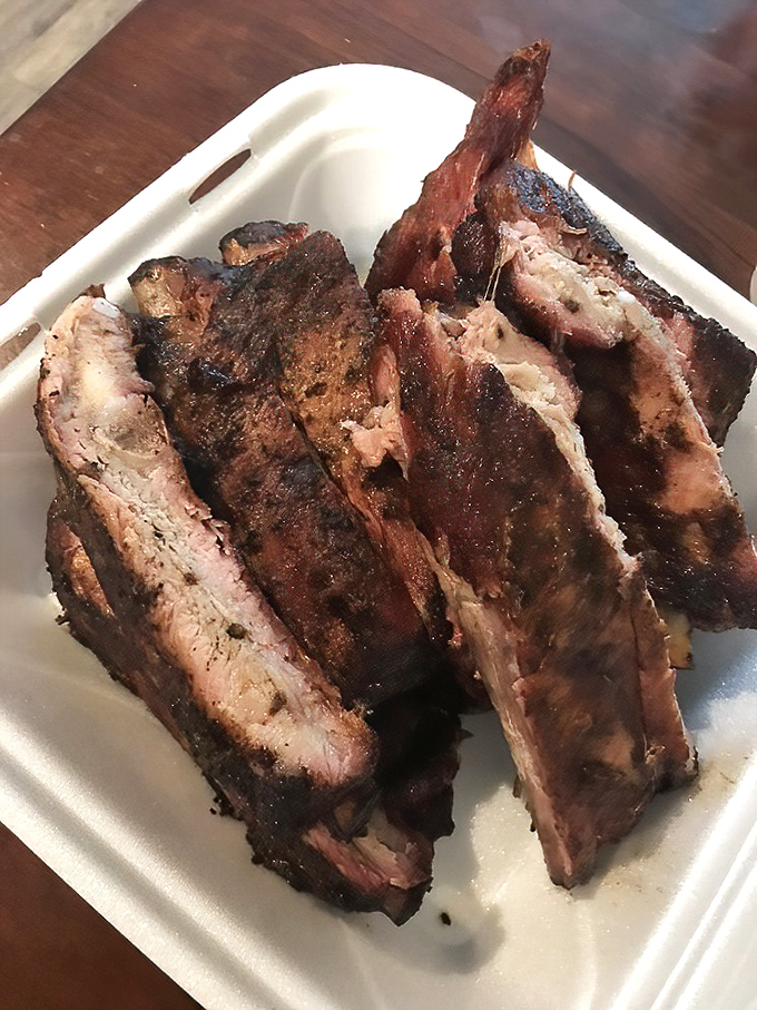 Ribs with that perfect pink smoke ring&mdash;the barbecue equivalent of Olympic gold. Each bite is a masterclass in patience and technique.