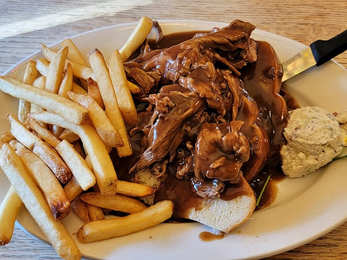 This hot roast beef sandwich isn't just lunch &ndash; it's therapy on a plate, complete with gravy generous enough to make your cardiologist nervous.
