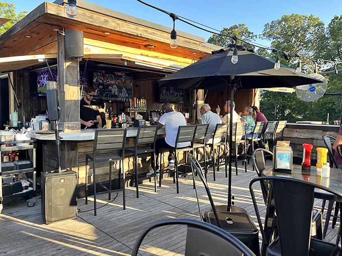 The rooftop patio bar—where fresh air, cold drinks, and sunset views elevate the simple act of ordering another round.