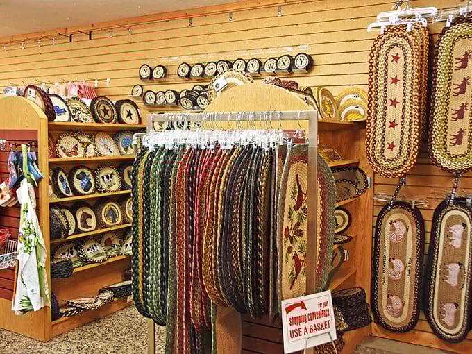 Braided rugs in patterns that evoke memories of grandma's kitchen, arranged with the care of a museum curator. Country charm meets practical durability.