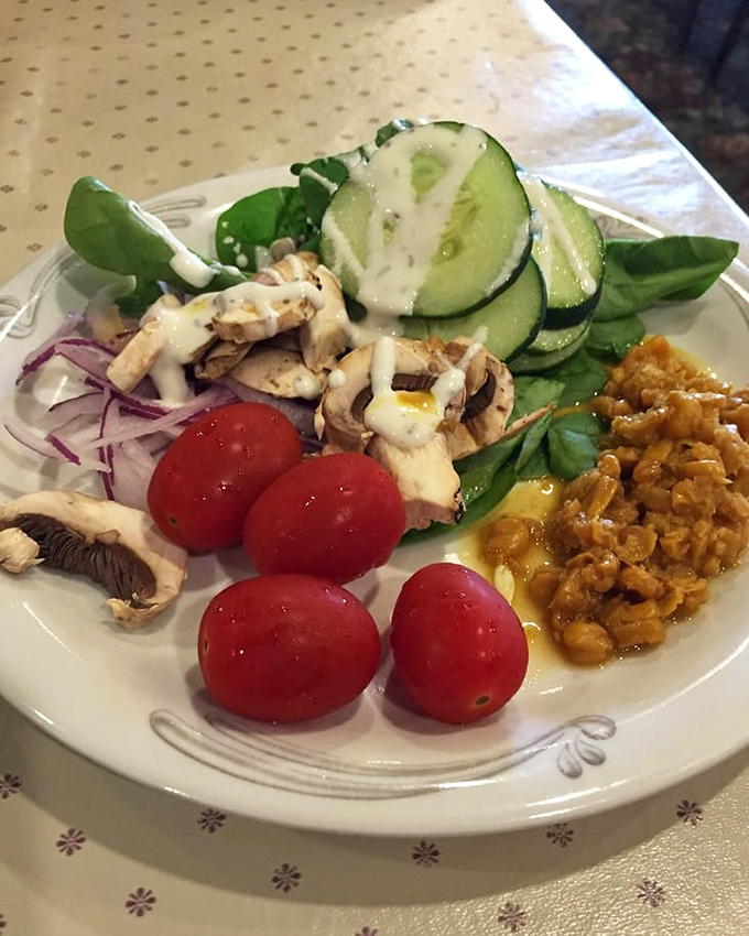 A salad plate for those maintaining the illusion that this visit is about balanced eating. We see you, and we respect the effort.