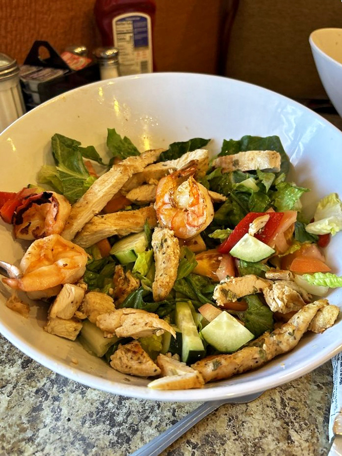 A salad that doesn't apologize for being healthy – grilled chicken and shrimp prove that "diner food" and "light option" aren't mutually exclusive.