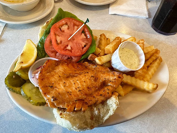 A fish sandwich that doesn't mess around&mdash;crispy, golden, and substantial enough to make you cancel dinner plans. Those crinkle-cut fries are no afterthought either. 