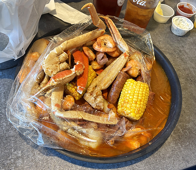 The seafood boil that requires both hands, several napkins, and absolutely no first-date jitters. Gloriously messy eating at its most rewarding.