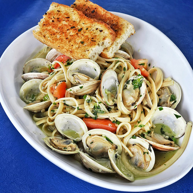 Linguini and clams&mdash;where Italy and New England have a delicious love child. That garlic bread isn't a side; it's essential equipment for sauce-sopping.