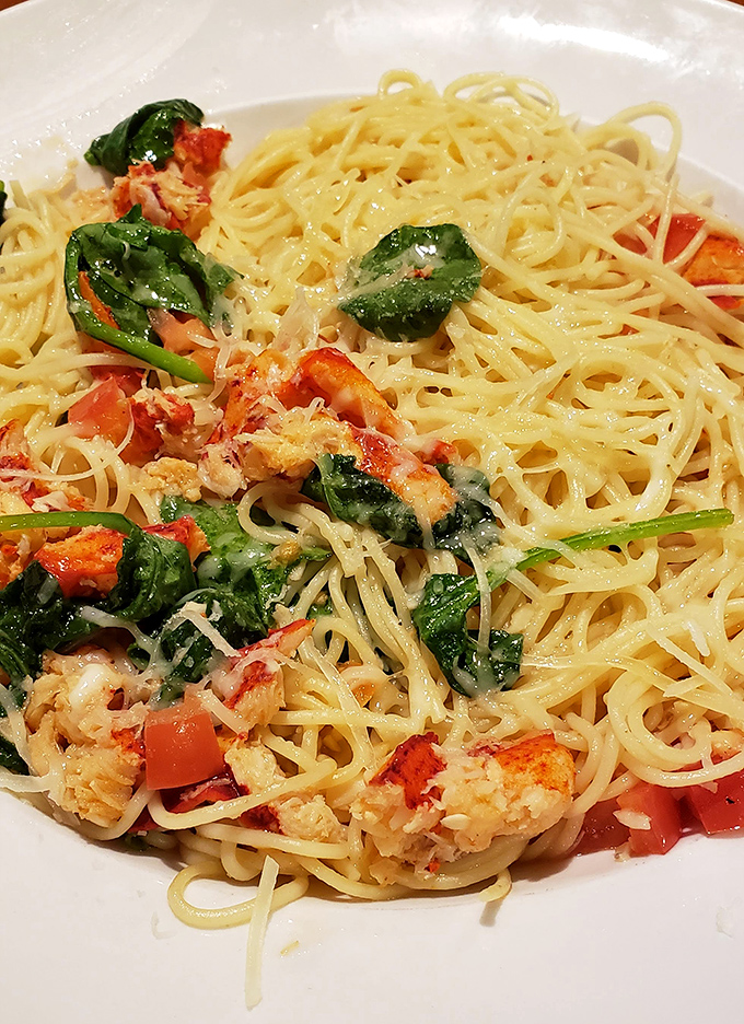Pasta perfection with oceanic upgrades! Tender lobster, bright tomatoes, and fresh spinach transform simple spaghetti into a dish worthy of your vacation highlight reel.