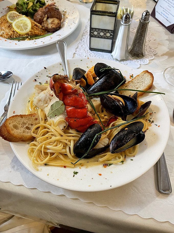 Seafood pasta that's essentially an underwater reunion party, where lobster, mussels, and linguine celebrate in a pool of buttery broth.