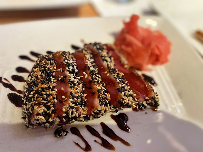 Sesame-crusted ahi tuna, seared to perfection. It's like the ocean's finest gift got dressed up for a night on the town.