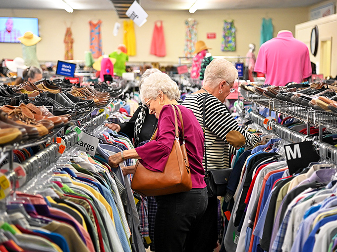 The thrill of the hunt in action. These seasoned shoppers know that patience and persistence lead to the best vintage finds.
