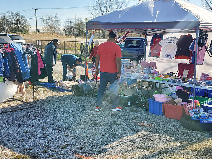 Early birds catch the deals as shoppers browse under morning light, proving treasure hunting is a sport best played at dawn.