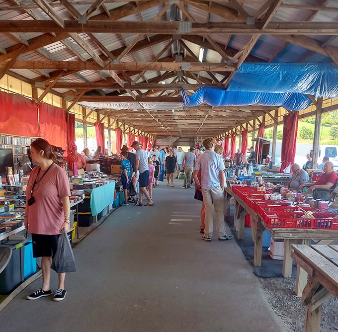 The covered walkway buzzes with the electricity of discovery. Every table holds potential treasures waiting for the right eyes to spot them.