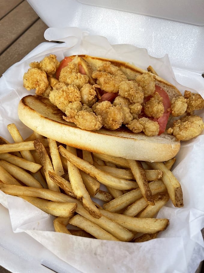 The shrimp po'boy: where crispy fried Gulf shrimp meet pillowy bread in a sandwich that requires both hands and several napkins.