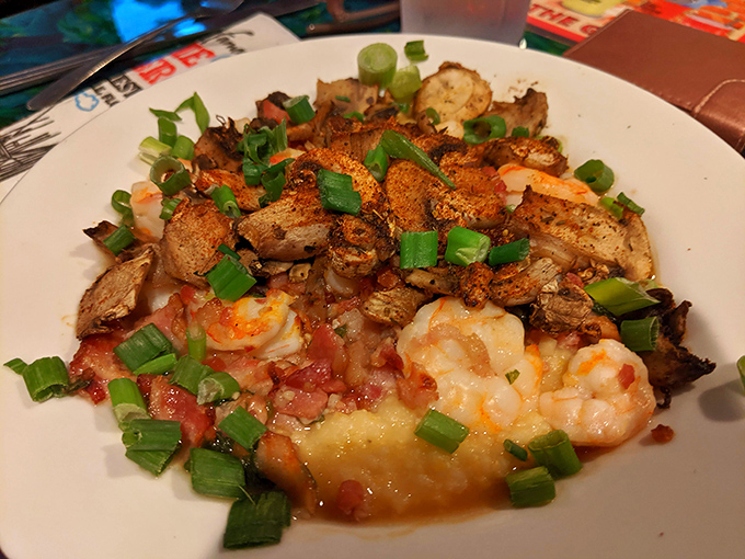 Shrimp and grits that would make a Southerner weep with joy. The green onions aren't just garnish &ndash; they're the confetti celebrating this perfect marriage of flavors.