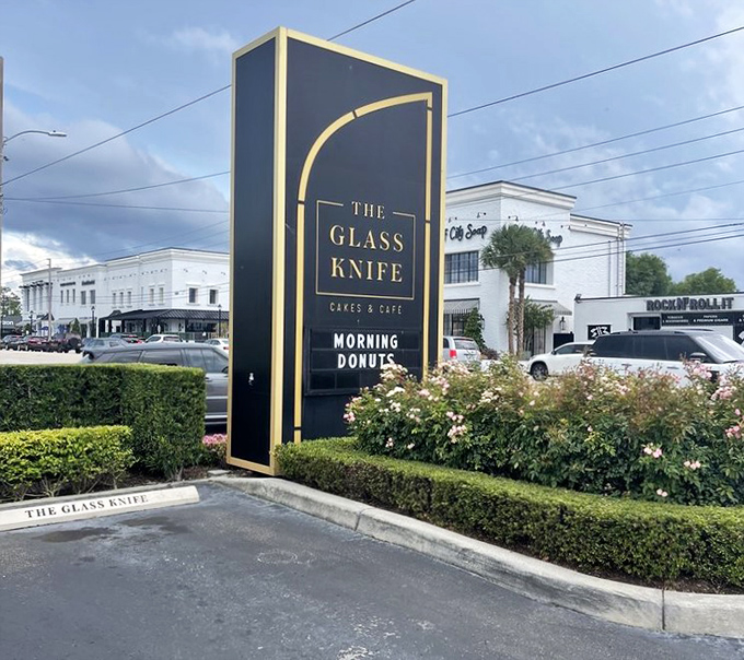 The elegant roadside sign stands tall like a beacon of hope for sugar-seekers&mdash;a sophisticated landmark announcing "salvation from ordinary desserts lies within."