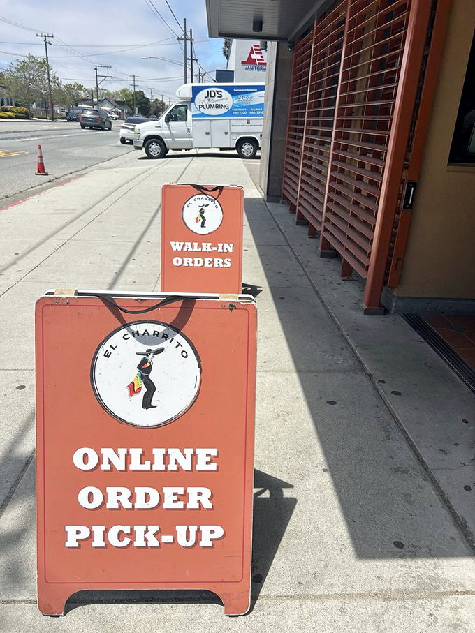 The sidewalk signage that's guided countless hungry souls to breakfast bliss. These orange harbingers of deliciousness have saved many a morning.