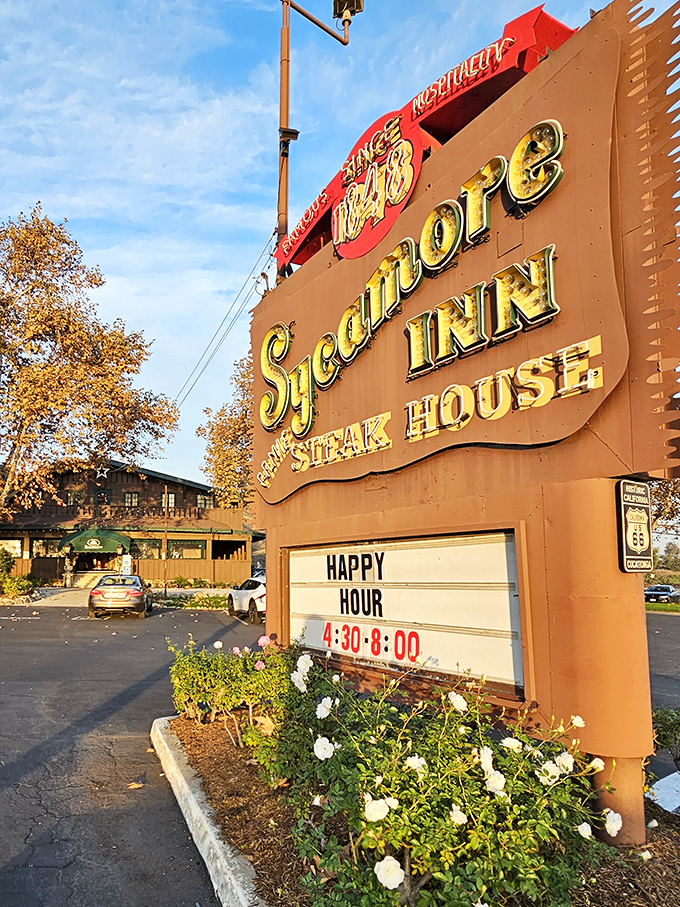 The vintage sign glows like a beacon for hungry travelers, its "Happy Hour" announcement perhaps the two most beautiful words in English.