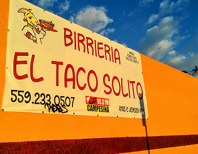 The sunny signage reveals the essential information—name, number, and the cartoon mascot that's become an unofficial Fresno food ambassador.