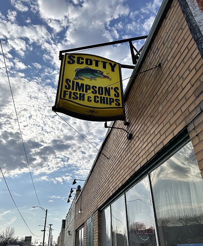 Against a perfect Michigan sky, the sign promises what generations of Detroiters already know: authentic fish and chips await within.