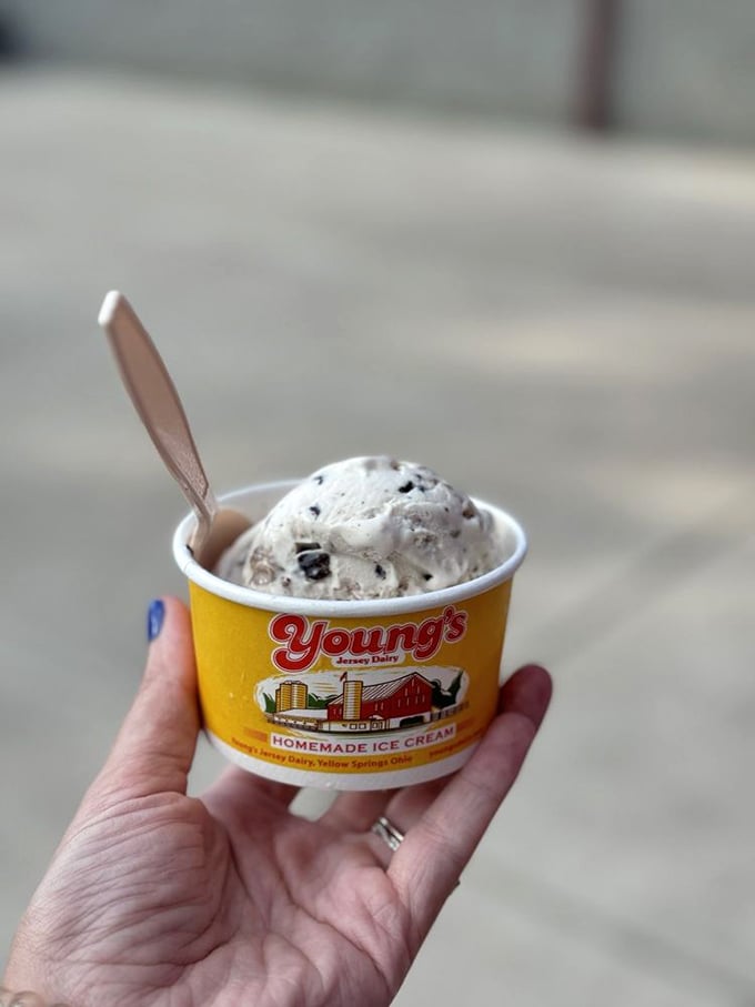 A scoop of cookies and cream perfection in Young's signature yellow cup—proof that happiness can indeed fit in the palm of your hand.