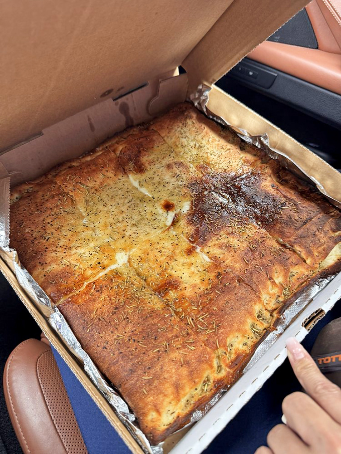 The white pizza in its to-go box&mdash;herb-flecked, golden-crusted perfection that makes car rides home an exercise in tremendous willpower.
