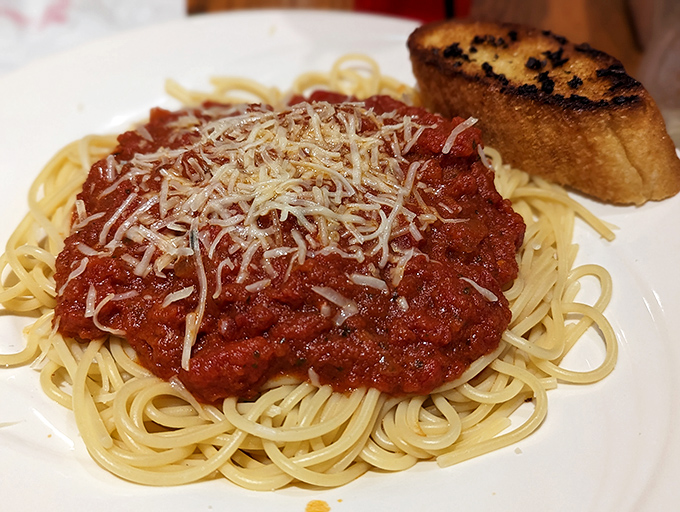 Spaghetti with meat sauce and a sprinkle of Parmesan that would make any Italian grandmother nod in reluctant approval.