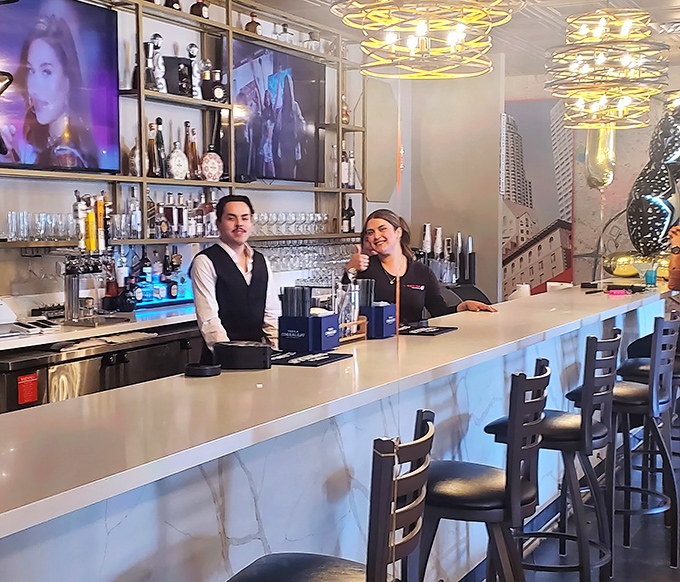 Friendly staff behind the bar ready to recommend the perfect pairing for your seafood feast.