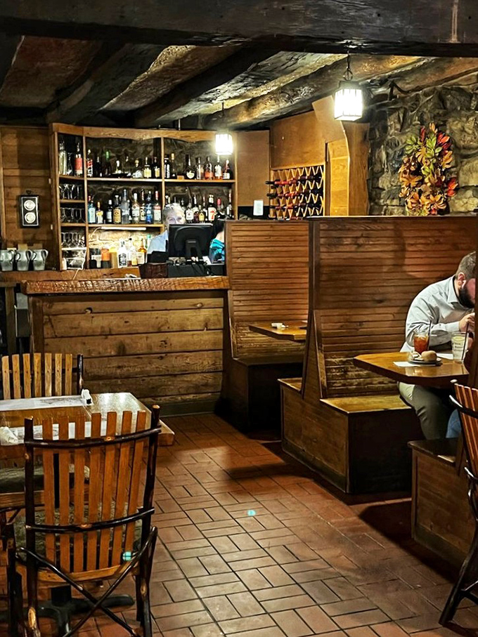 The tavern's bar area offers intimate wooden booths where you can plot revolution or just decide on dessert. Either way, history approves.