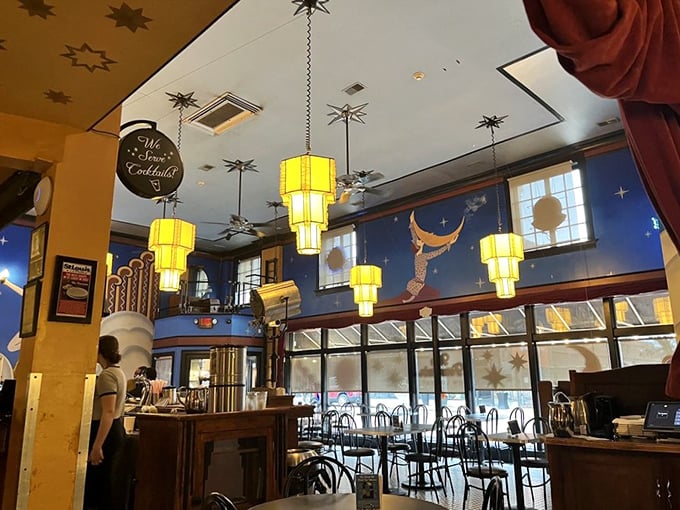 The space feels both intimate and grand simultaneously. Those pendant lights cast the kind of glow that makes everyone look like movie stars.