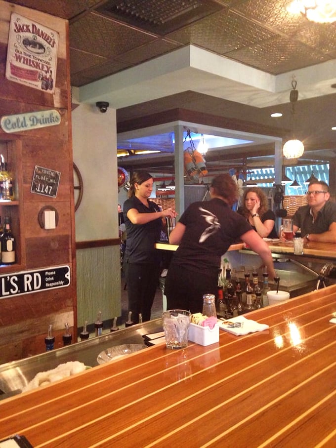 Where the magic happens&mdash;skilled bartenders crafting liquid happiness while patrons await their next culinary adventure.