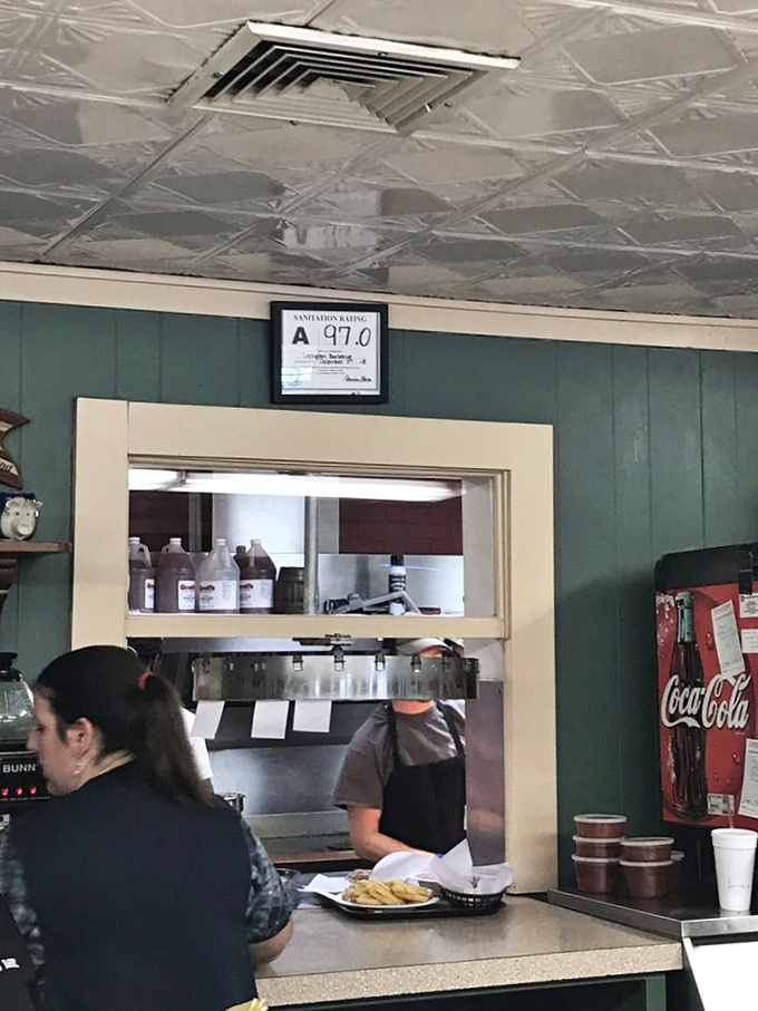 Behind every great barbecue is a team that understands the sacred contract between pitmaster and patron. The pass-through window: barbecue's stage door.