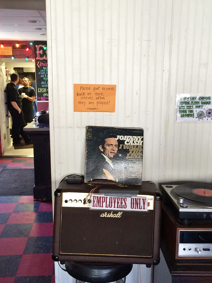 "Please put records back in their sleeves"&mdash;a sign that tells you everything about Eli's vibe: analog pleasures in a digital world. 