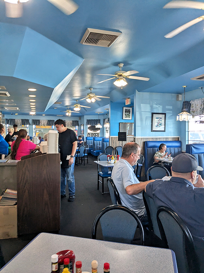 The dining room where strangers become temporary breakfast companions. Everyone united by the universal language of "pass the hot sauce."