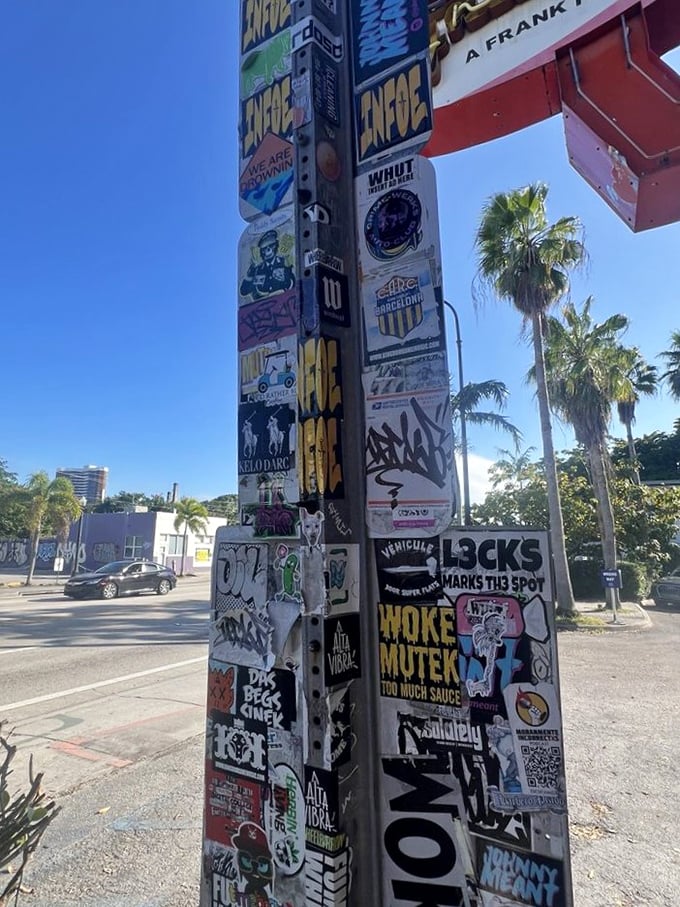 A pole plastered with stickers&mdash;the community bulletin board of street cred that says, "Cool people eat here."