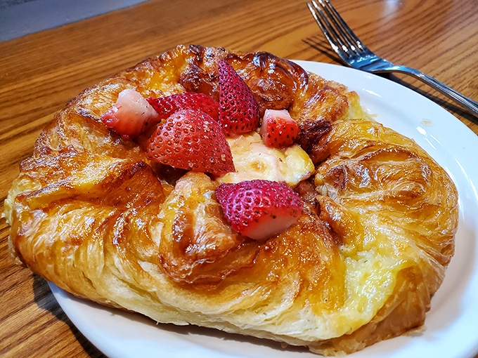 Strawberry Danish that makes you question all other breakfast choices. The glistening fruit and flaky pastry create a morning symphony that Mozart would envy.