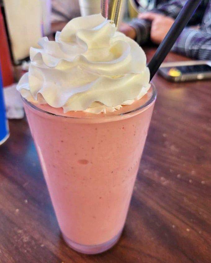 The strawberry shake arrives like a pink cloud topped with whipped cream &ndash; childhood nostalgia in a glass that tastes like summer.