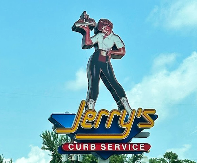 The vintage carhop signage stands tall against the sky&mdash;a nostalgic landmark that's outlasted countless food trends and fads.