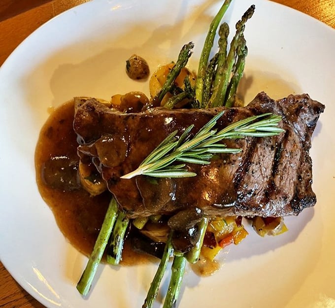 A steak that's dressed for success &ndash; tender beef in rich sauce with asparagus standing at attention, ready for your dining pleasure.