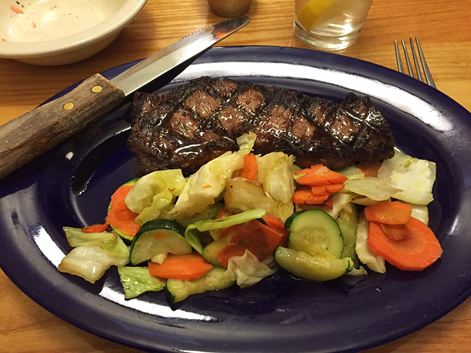 A perfectly seared steak shares the spotlight with a rainbow of vegetables&mdash;proof that simple food done right is culinary poetry.