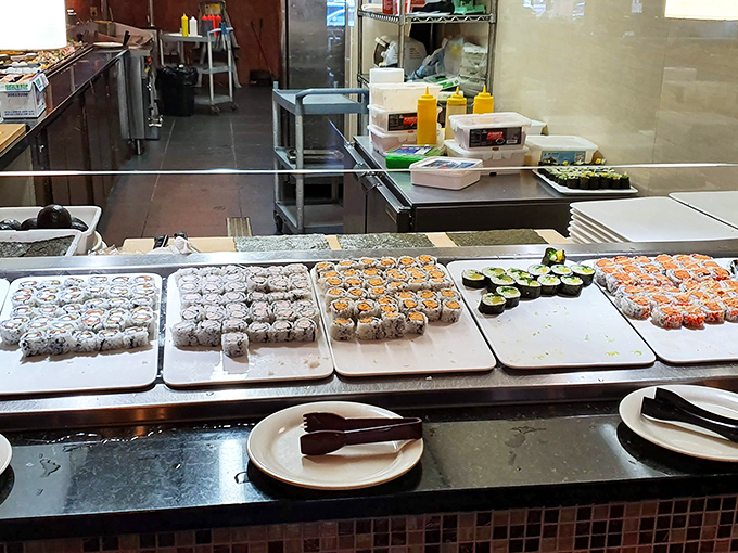 Sushi rolls lined up with military precision demonstrate that "all-you-can-eat" doesn't have to mean sacrificing craftsmanship or presentation.