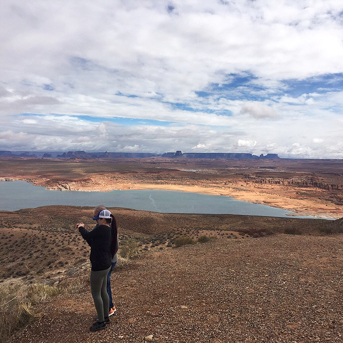 Even in an age of endless selfies, some views demand to be the star of the photo. This visitor wisely plays a supporting role.