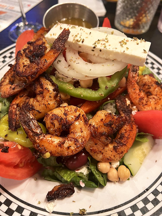 The Santorini Salad brings Mediterranean flair to Florida. Those blackened shrimp and that block of feta are having the vacation you wish you were on.