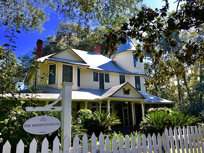 The Simonton House's white picket fence and butterfly emblem seem to whisper, "Yes, places like this still exist in Florida."