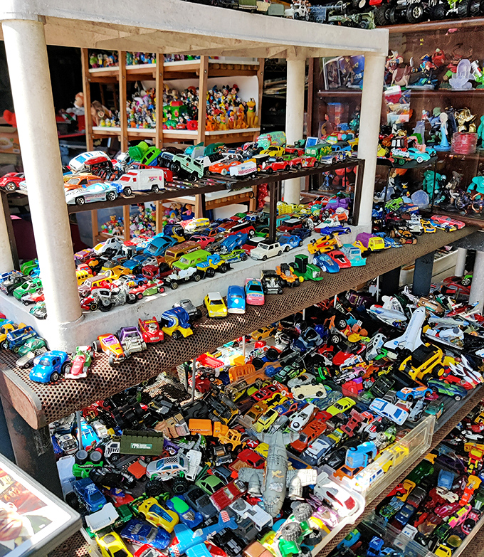Toy cars in magnificent chaos&mdash;a miniature traffic jam spanning decades of automotive history. Every boy's dream collection, no assembly required.
