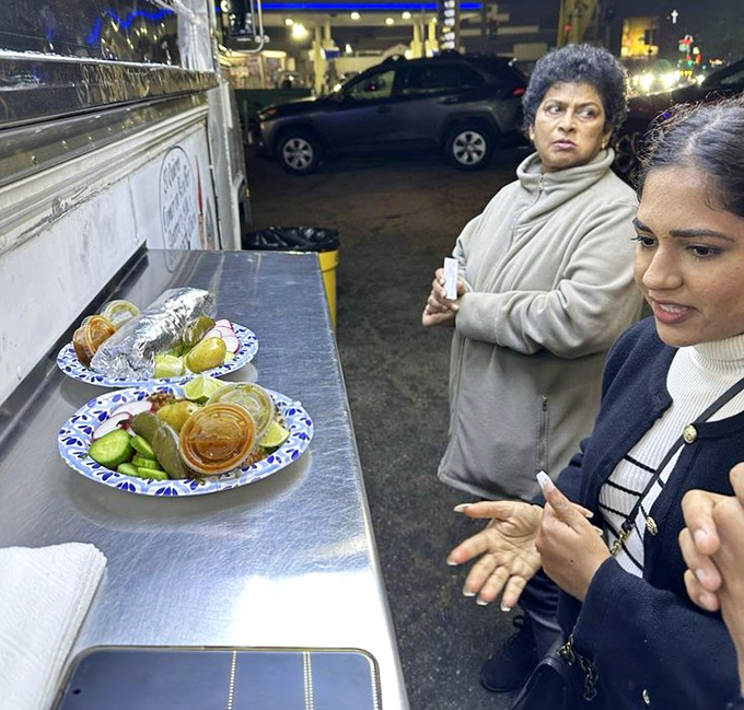 The makeshift dining counter where strangers become friends, united by the universal language of "mmm" and "have you tried the al pastor?"