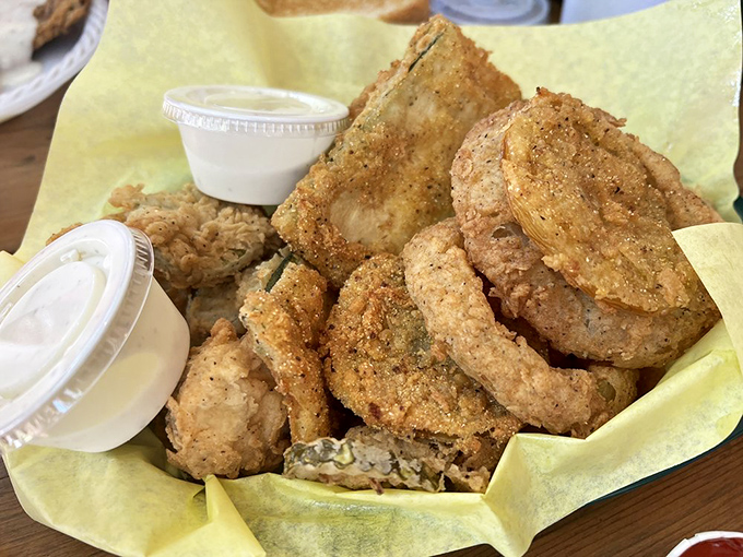A basket of golden-fried treasures that proves vegetables taste better when they've taken a dip in seasoned batter and bubbling oil.