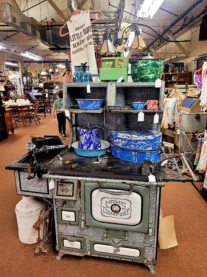 This magnificent vintage "Home Comfort" stove isn't just kitchen equipment – it's a sculptural masterpiece of American industrial design with splashes of blue enamelware.