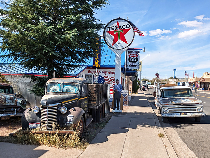 These vintage cars aren't props&mdash;they're retired road warriors standing guard outside a fellow Route 66 legend.