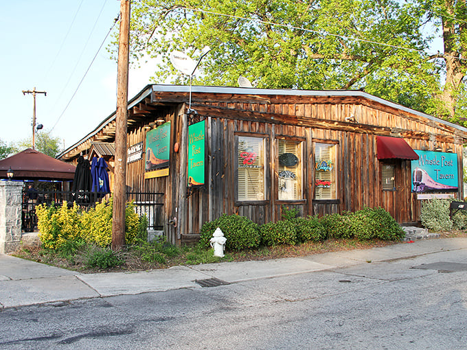Rustic meets refreshment at the Whistle Post Tavern, where weathered wood siding houses cold drinks and warm conversations just steps from the historic district.